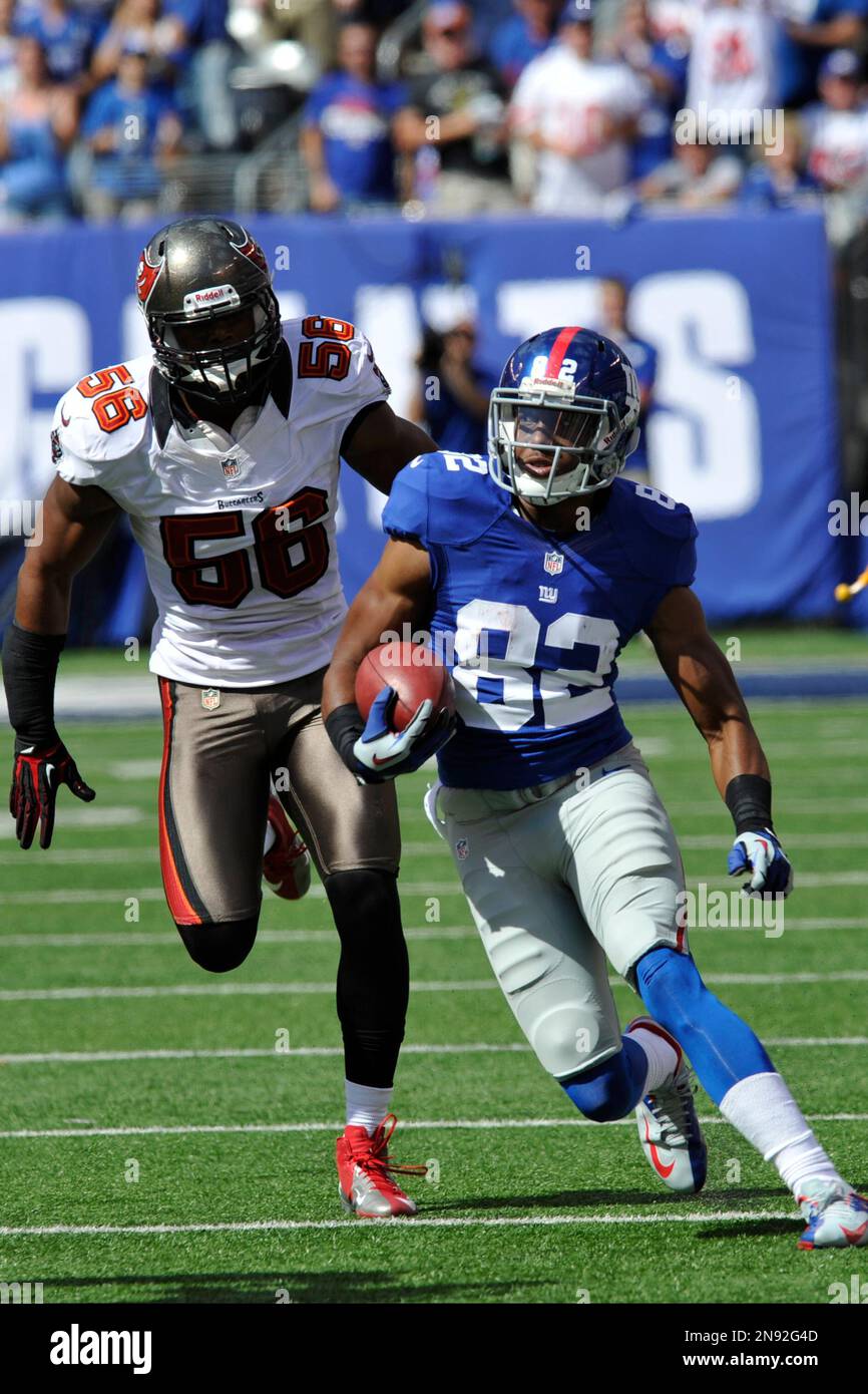 New York Giants' Rueben Randle, right, returns a punt during the first ...