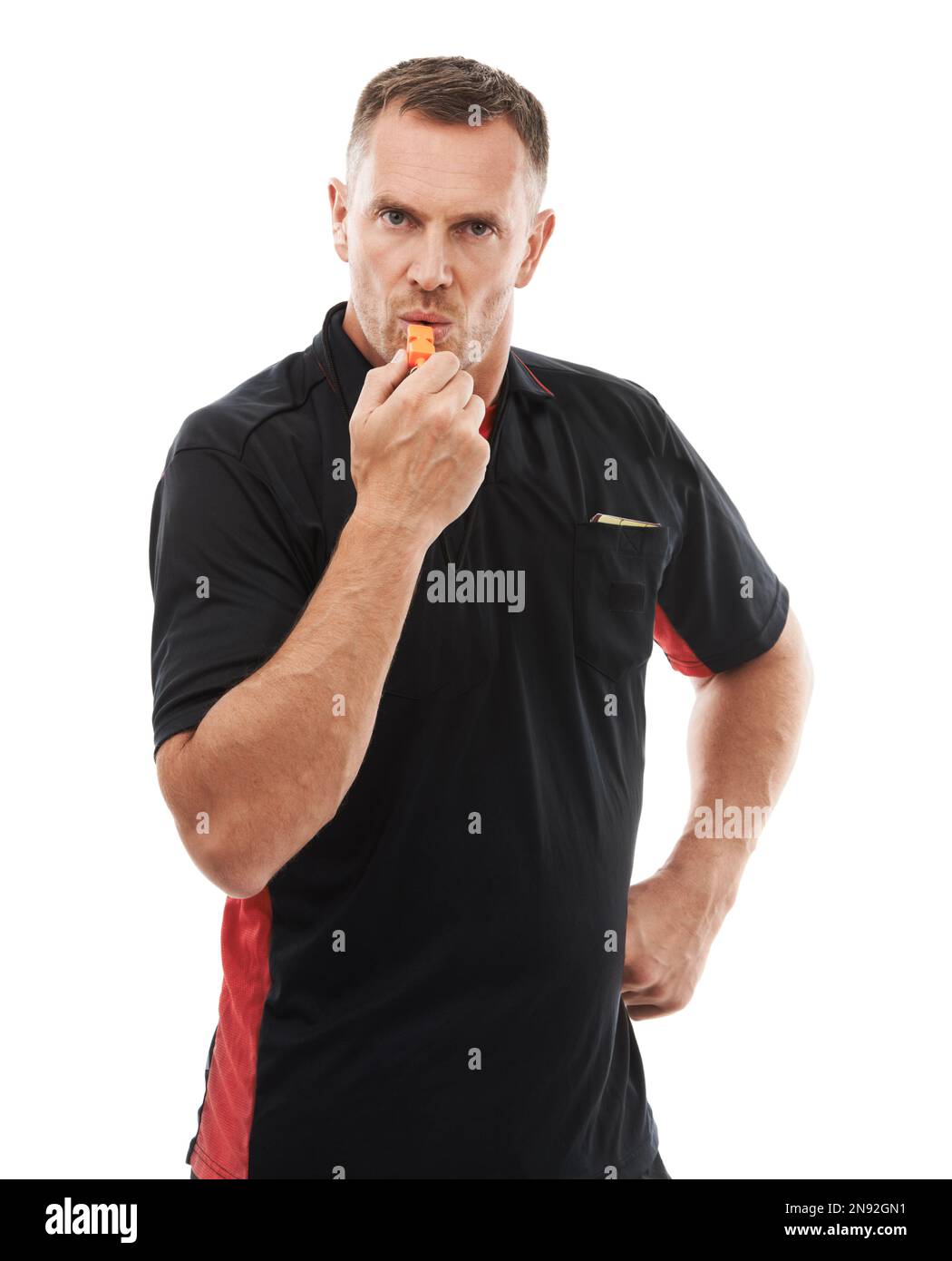 Portrait, referee and man blowing whistle, stern or gesture in studio ...