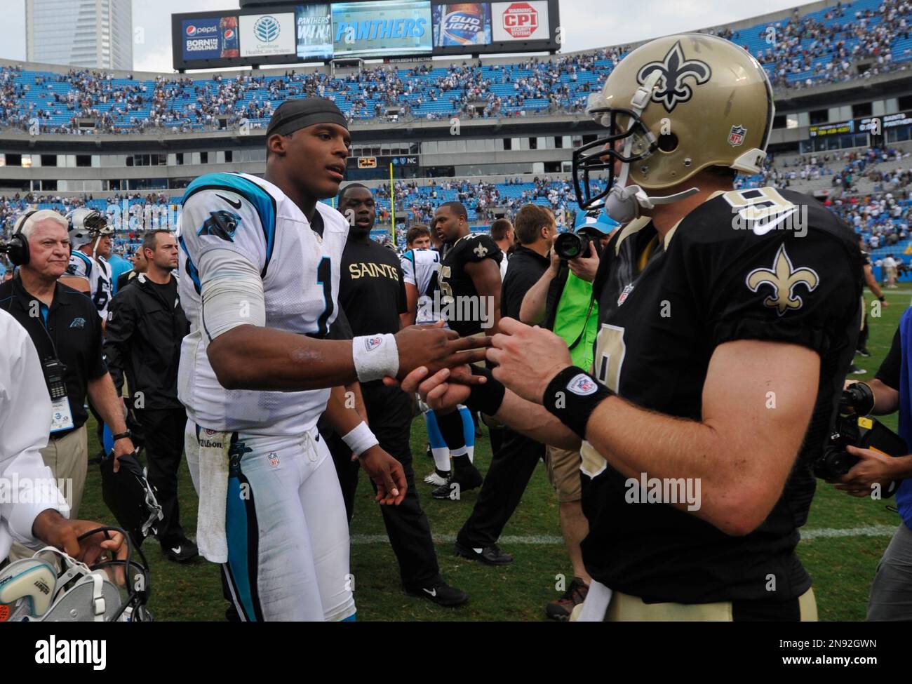 Carolina Panthers' Cam Newton (1) greets New Orleans Saints' Drew Brees ...