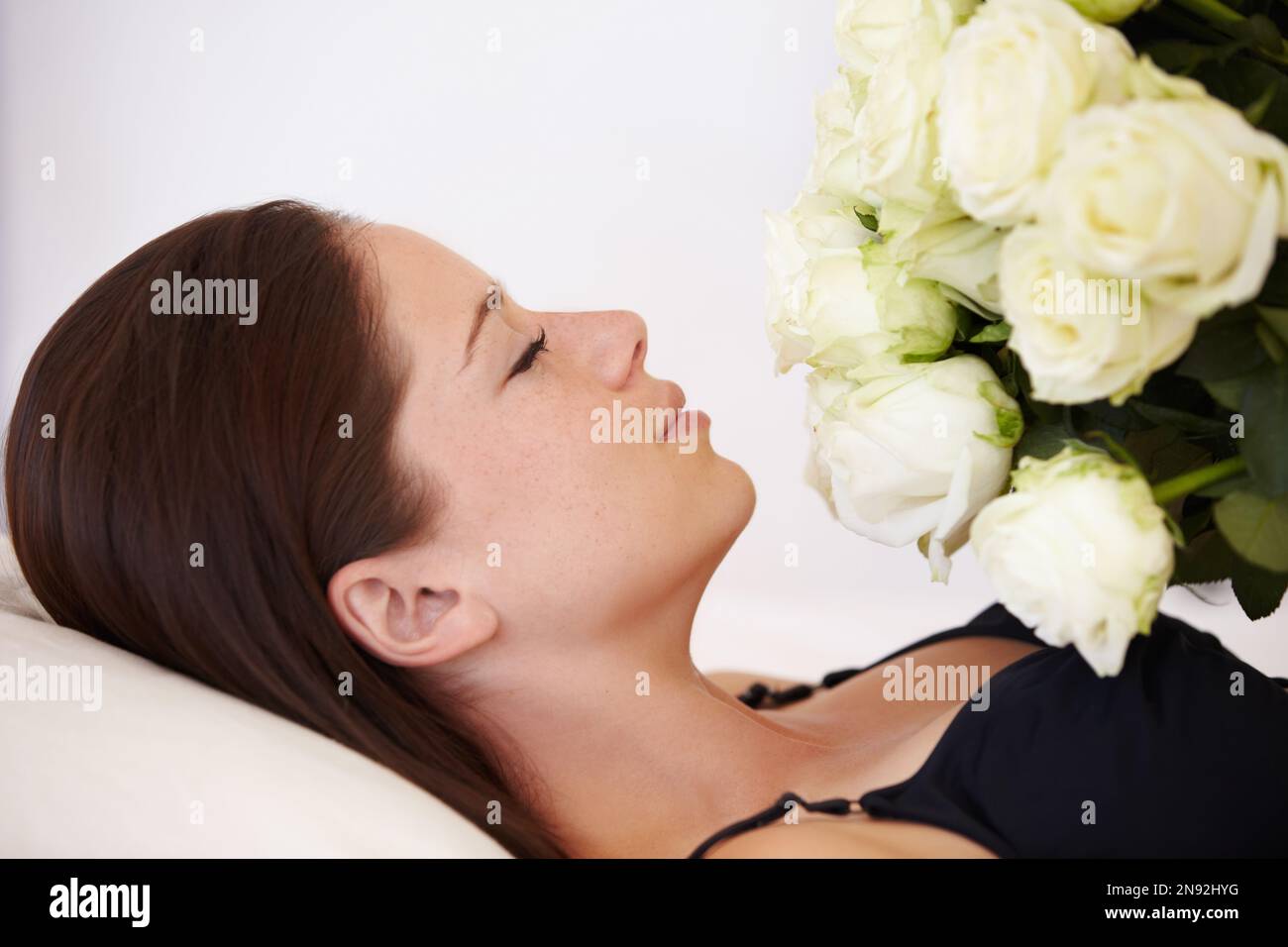Flowers, roses and woman sleeping in bedroom for resting, relax and ...