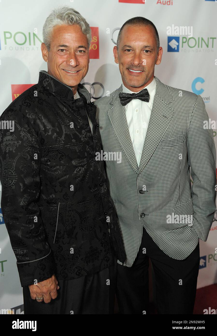 Greg Louganis, left and guest arrive at "Voices On Point" Concert ...