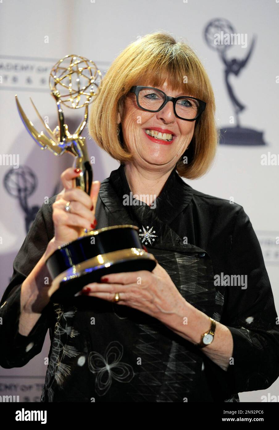 Gemma Jackson poses backstage with her award for outstanding art ...