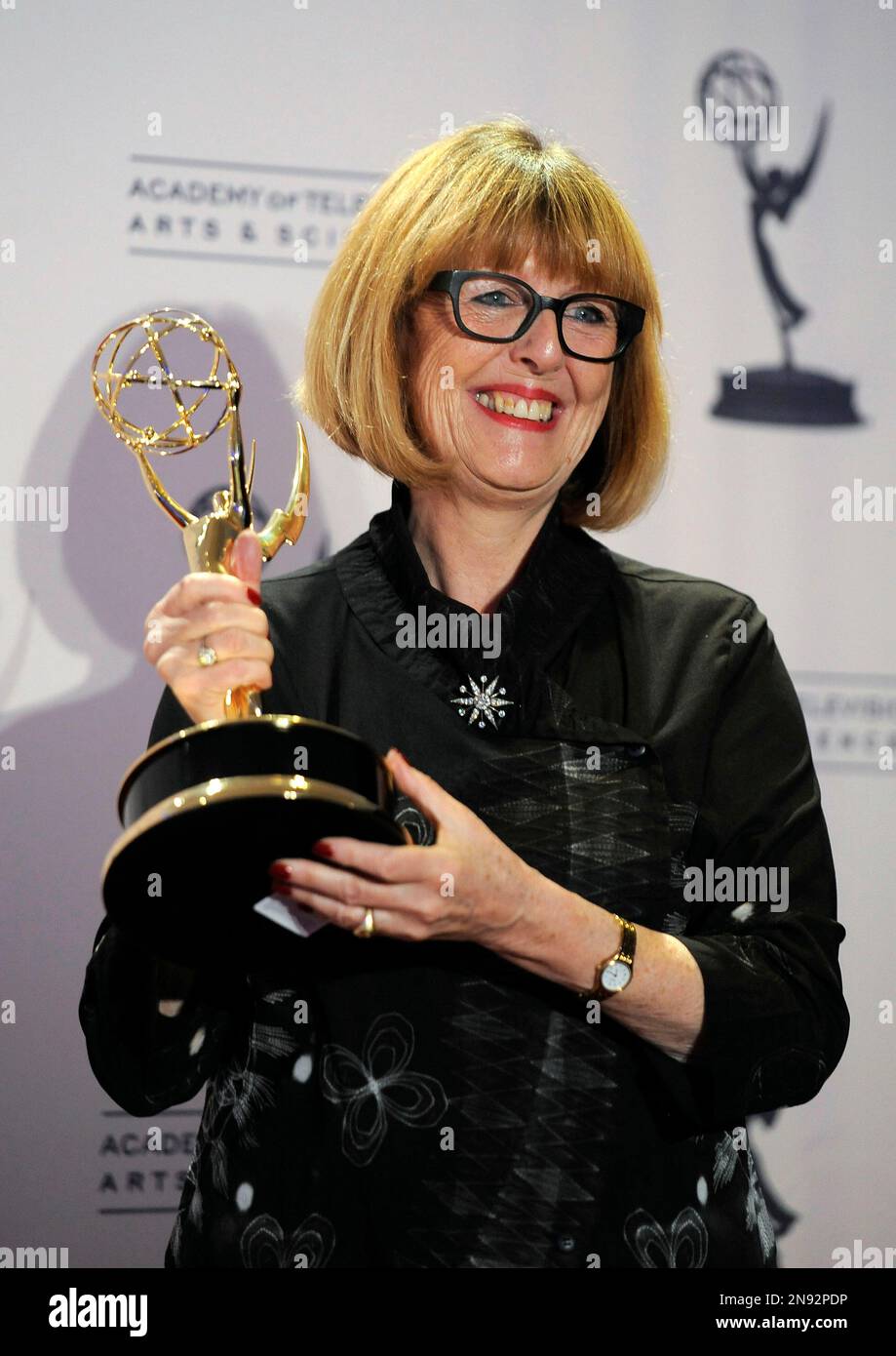 Gemma Jackson poses backstage with her award for outstanding art ...