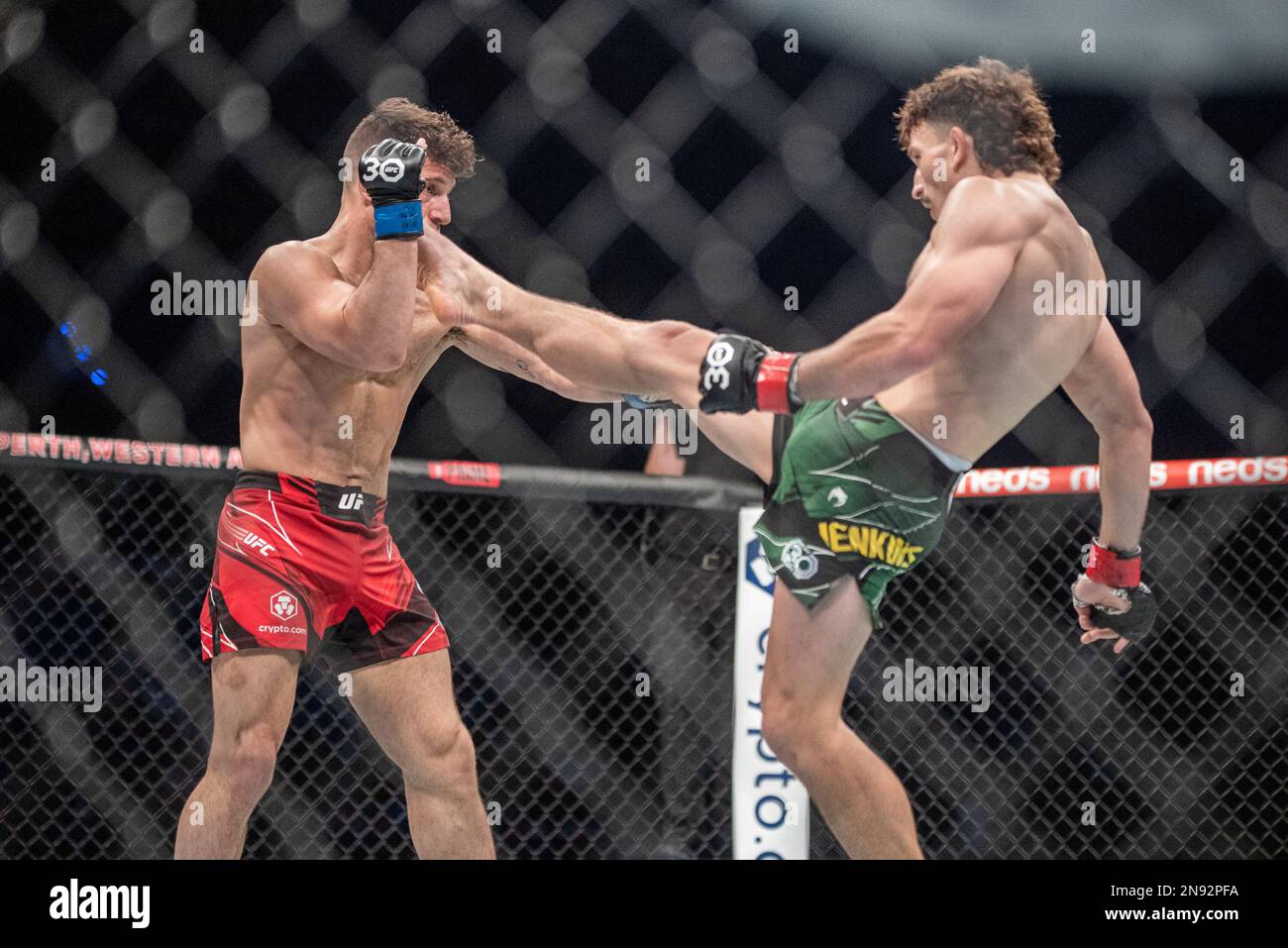 PERTH, AUSTRALIA - FEBRUARY 12: (R-L) Jack Jenkins kicks Don Shainis in ...