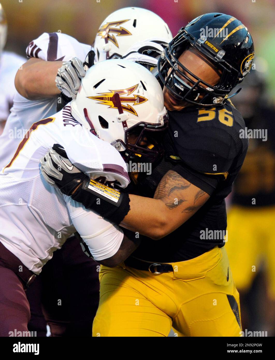 Missouri defensive lineman Shane Ray, right, stops Arizona State ...