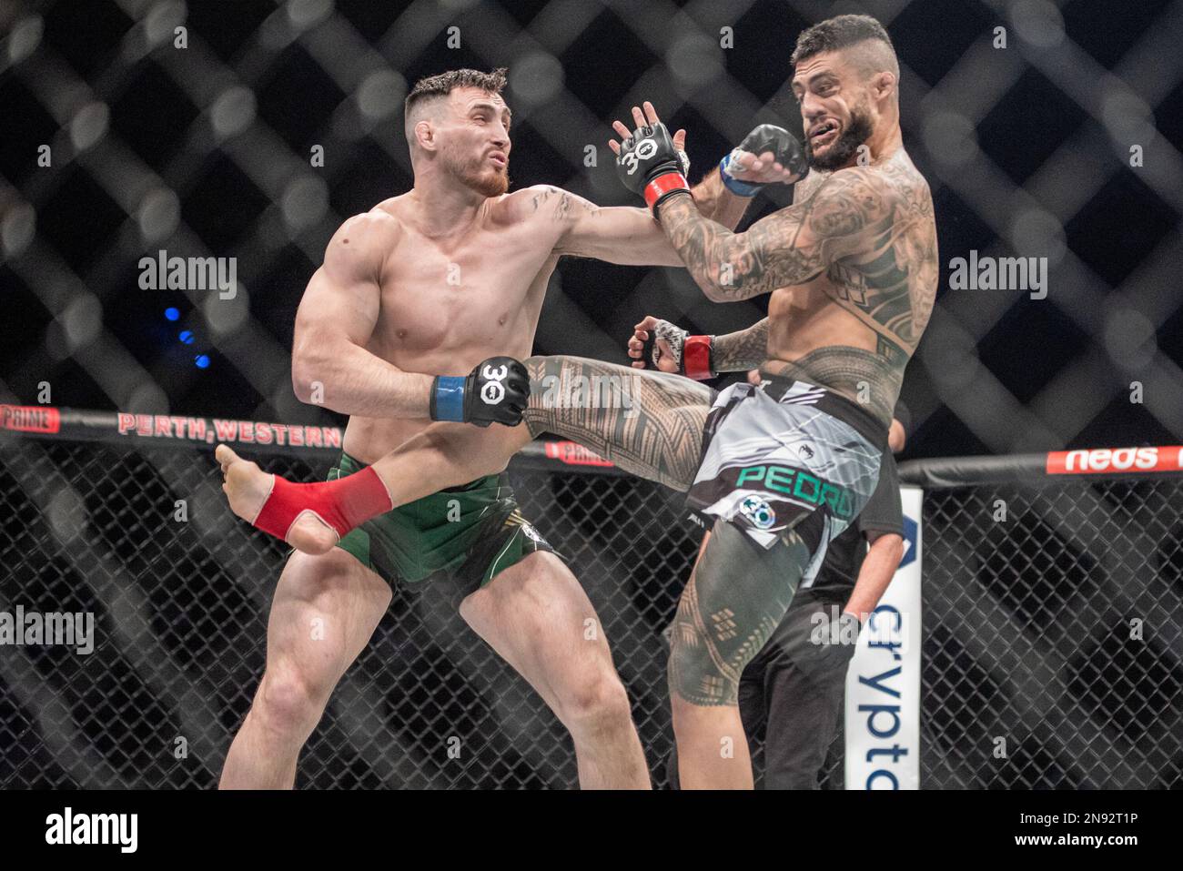 PERTH, AUSTRALIA - FEBRUARY 12: (L-R) Modestas Bukauskas punches Tyson ...