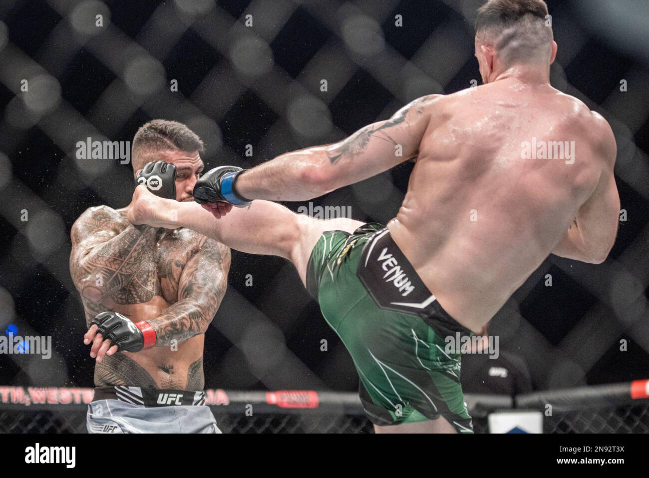 PERTH, AUSTRALIA - FEBRUARY 12: (R-L) Modestas Bukauskas kicks Tyson ...