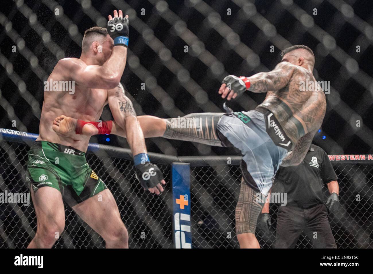 PERTH, AUSTRALIA - FEBRUARY 12: (R-L) Tyson Pedro kicks Modestas ...
