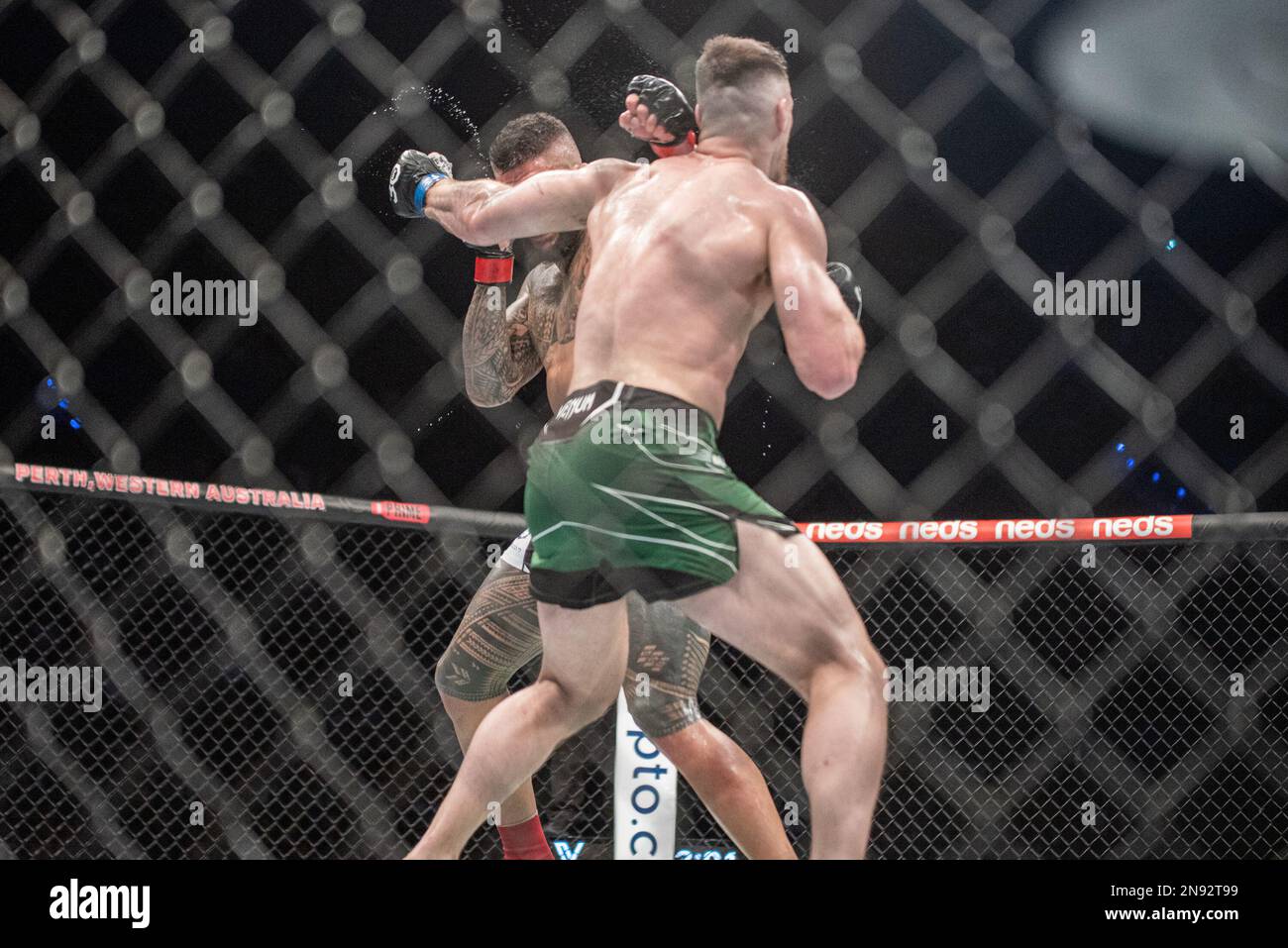 PERTH, AUSTRALIA - FEBRUARY 12: (R-L) Modestas Bukauskas punches Tyson ...