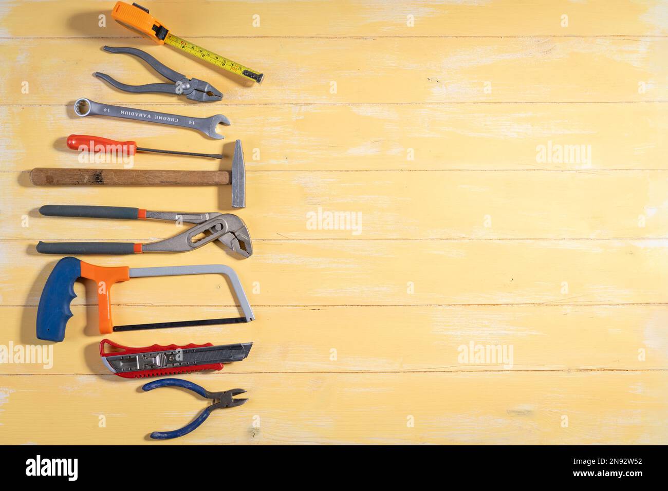 All tools supplies home construction on the yellow wooden background ...