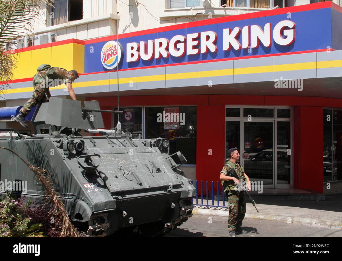 Lebanese army soldiers with their armored personnel carrier, stand ...