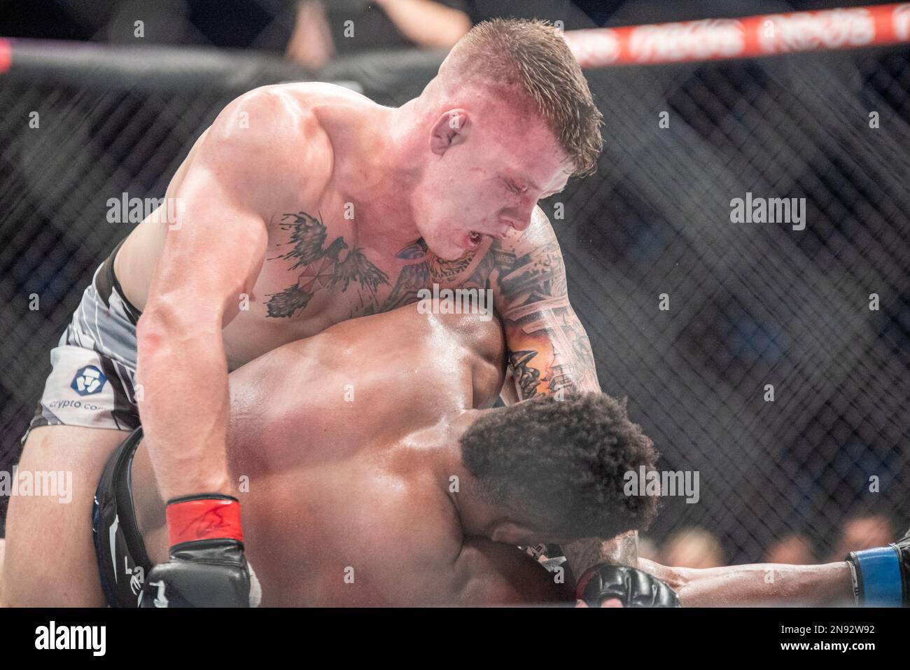 PERTH, AUSTRALIA - FEBRUARY 12: Jimmy Crute (top) controls the body of ...