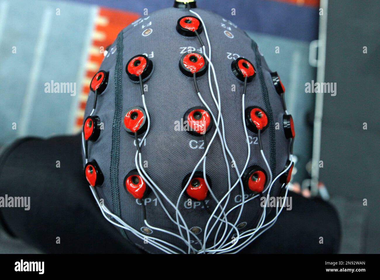 Michele Tavella wears an electronic device to send brain-computer ...