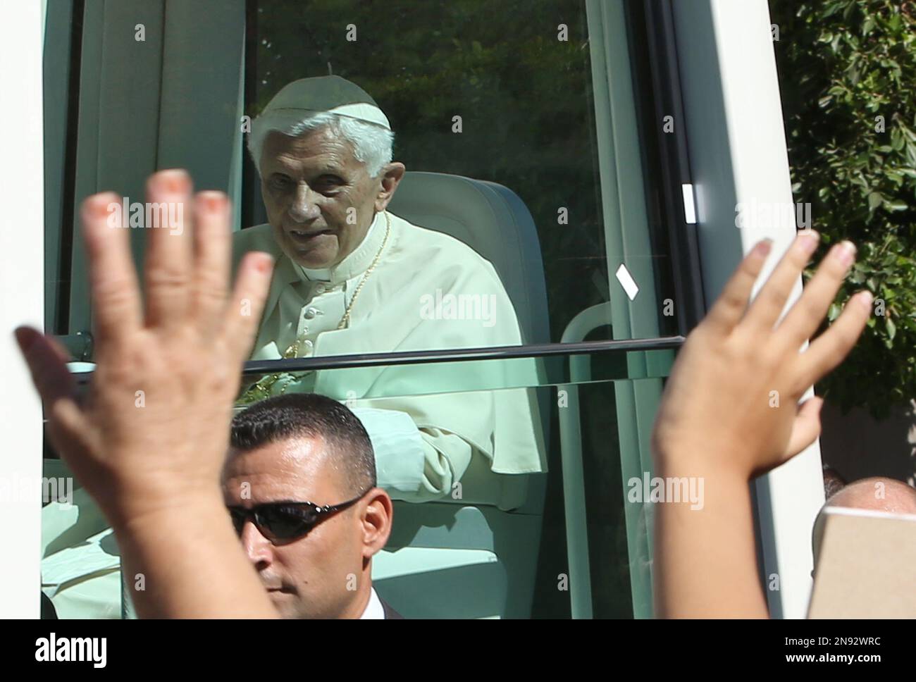 Lebanese faithful wave to the Pope Benedict XVI upon his arrival at the ...