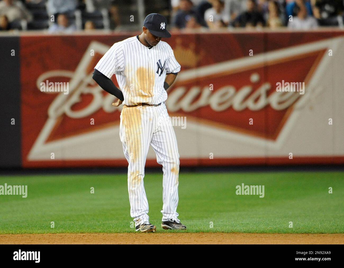 New York Yankees shortstop Eduardo Nunez reacts after his fielding ...