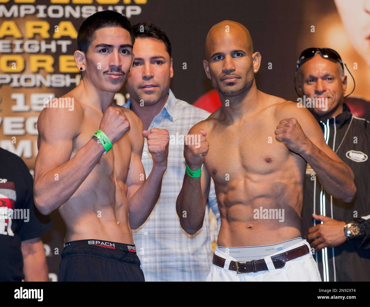 Leo Santa Cruz, left, and Eric Morel pose for photos after weighing in Friday, Sept. 14, 2012 ...