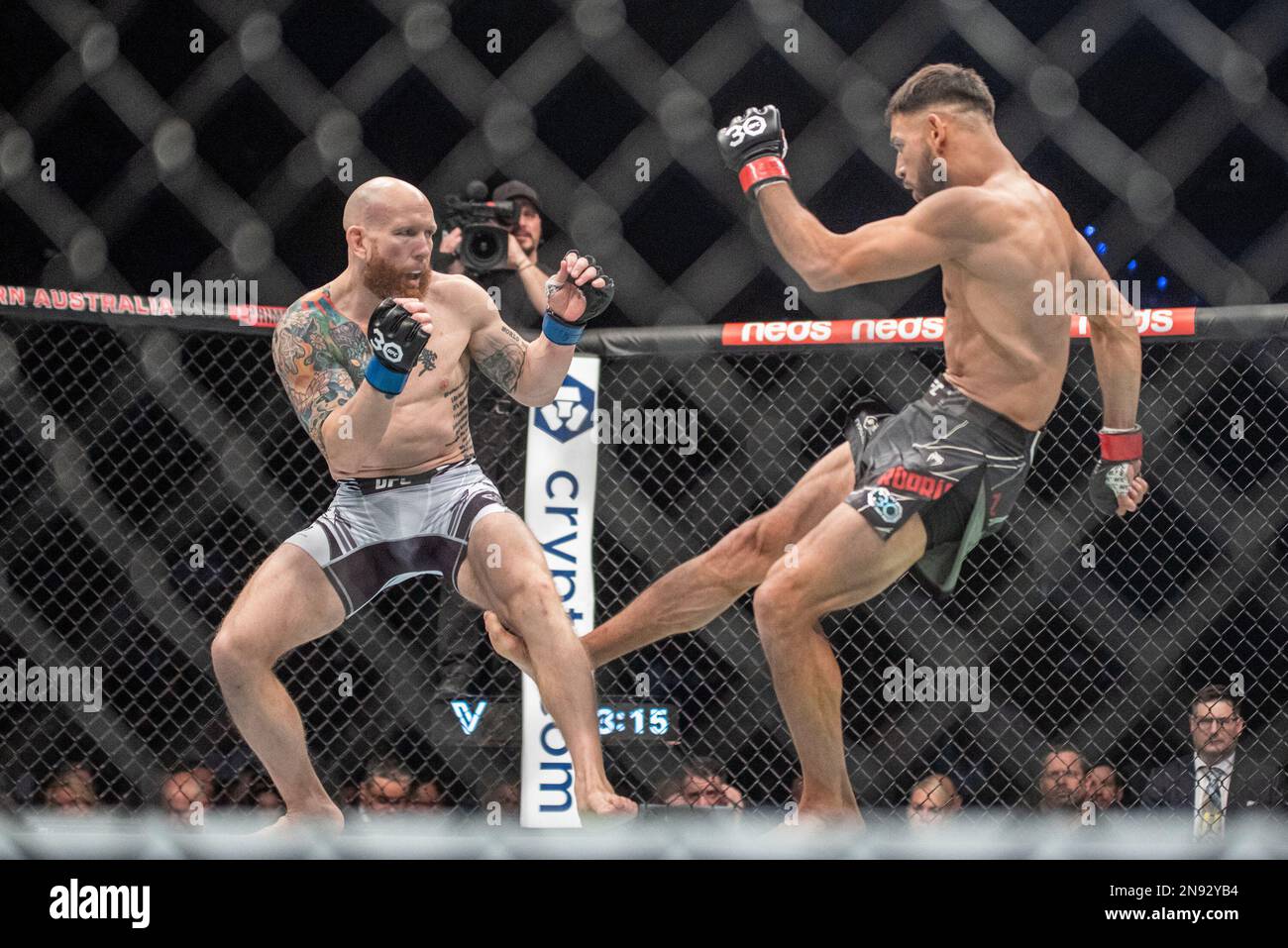 PERTH, AUSTRALIA - FEBRUARY 12: (R-L) Yair Rodriguez kicks Josh Emmett ...
