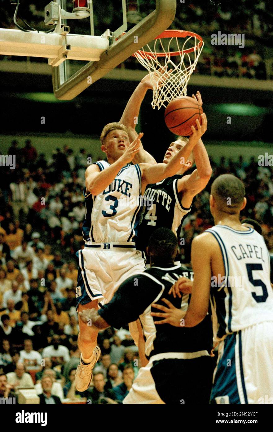 Duke's Marty Clark (3) tries to score against Marquette's Jim McIlvaine ...