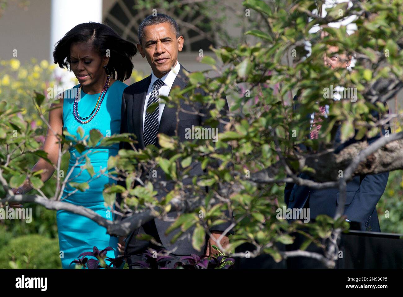 President Barack Obama and first lady Michelle Obama walk to the South ...