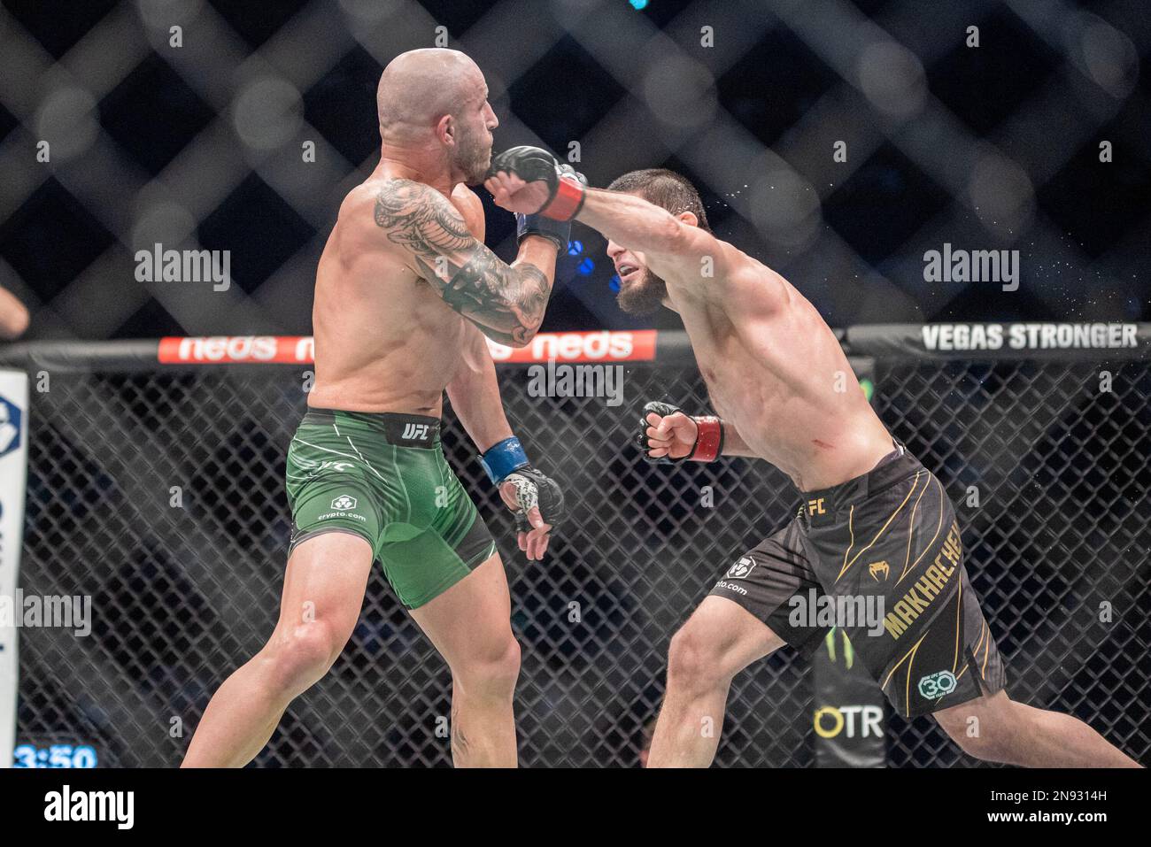 PERTH, AUSTRALIA - FEBRUARY 12: (R-L) Islam Makhachev punches Alex ...