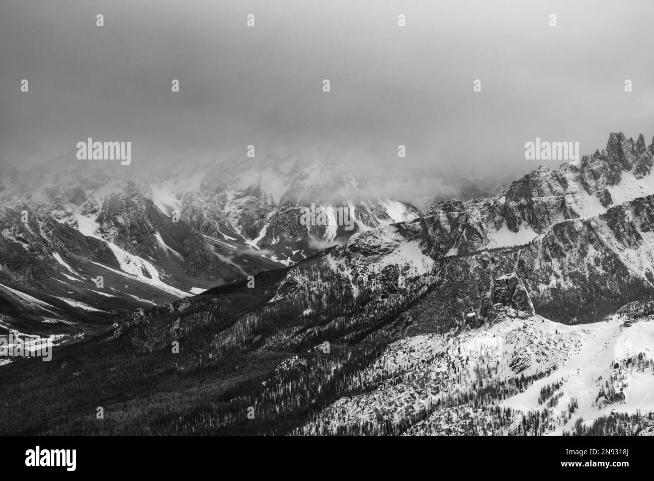 Clouds carrying snow in the italian alps Stock Photo - Alamy