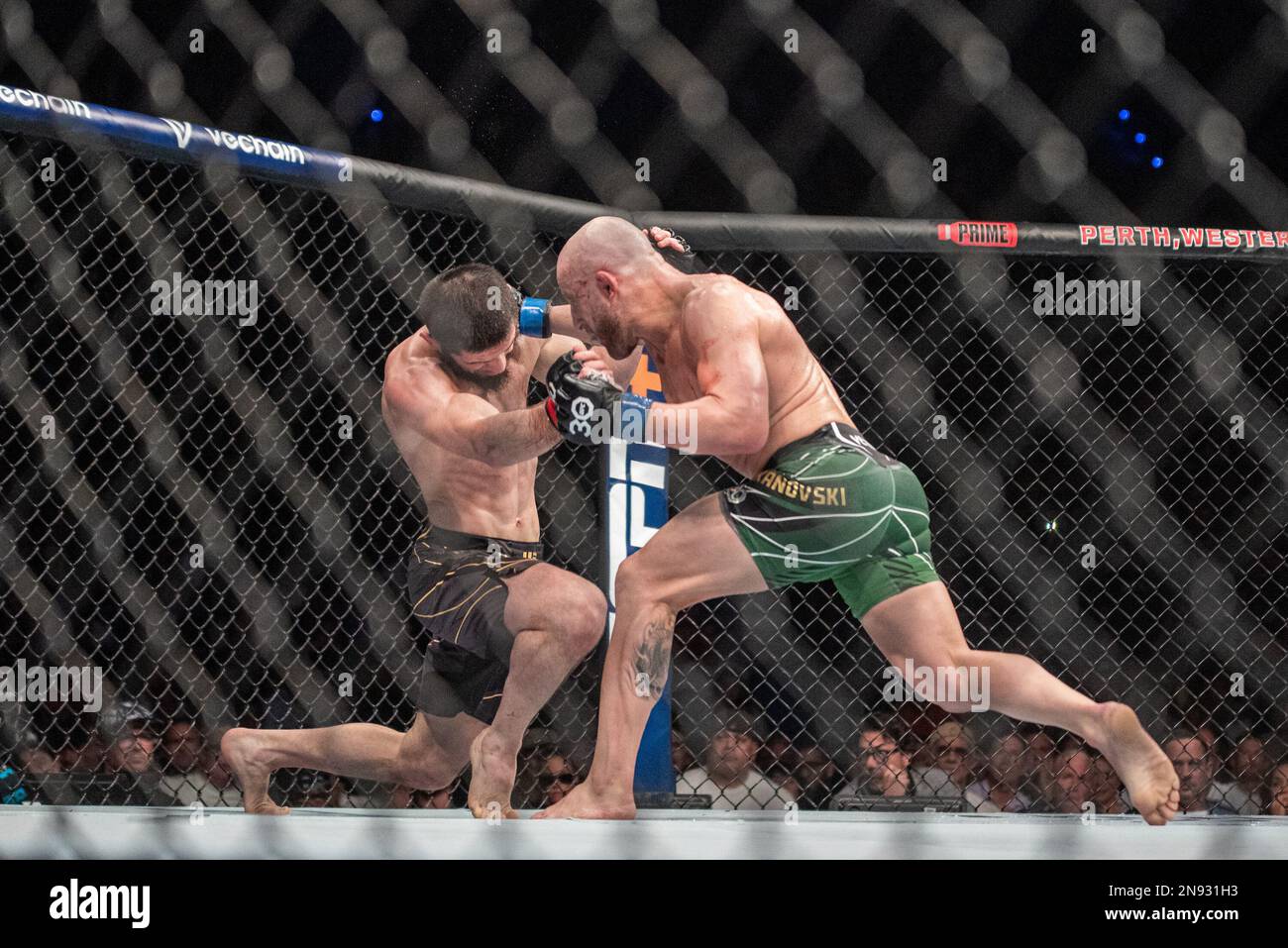 PERTH, AUSTRALIA - FEBRUARY 12: (R-L) Alex Volkanovski punches Islam ...