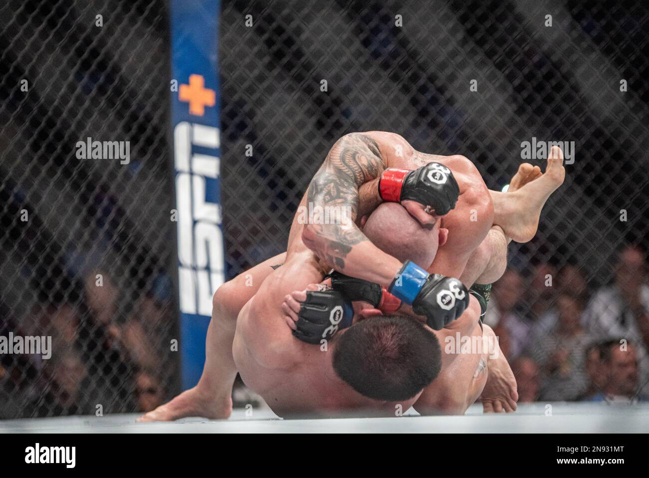 PERTH, AUSTRALIA - FEBRUARY 12: (L-R) Alex Volkanovski controls the ...