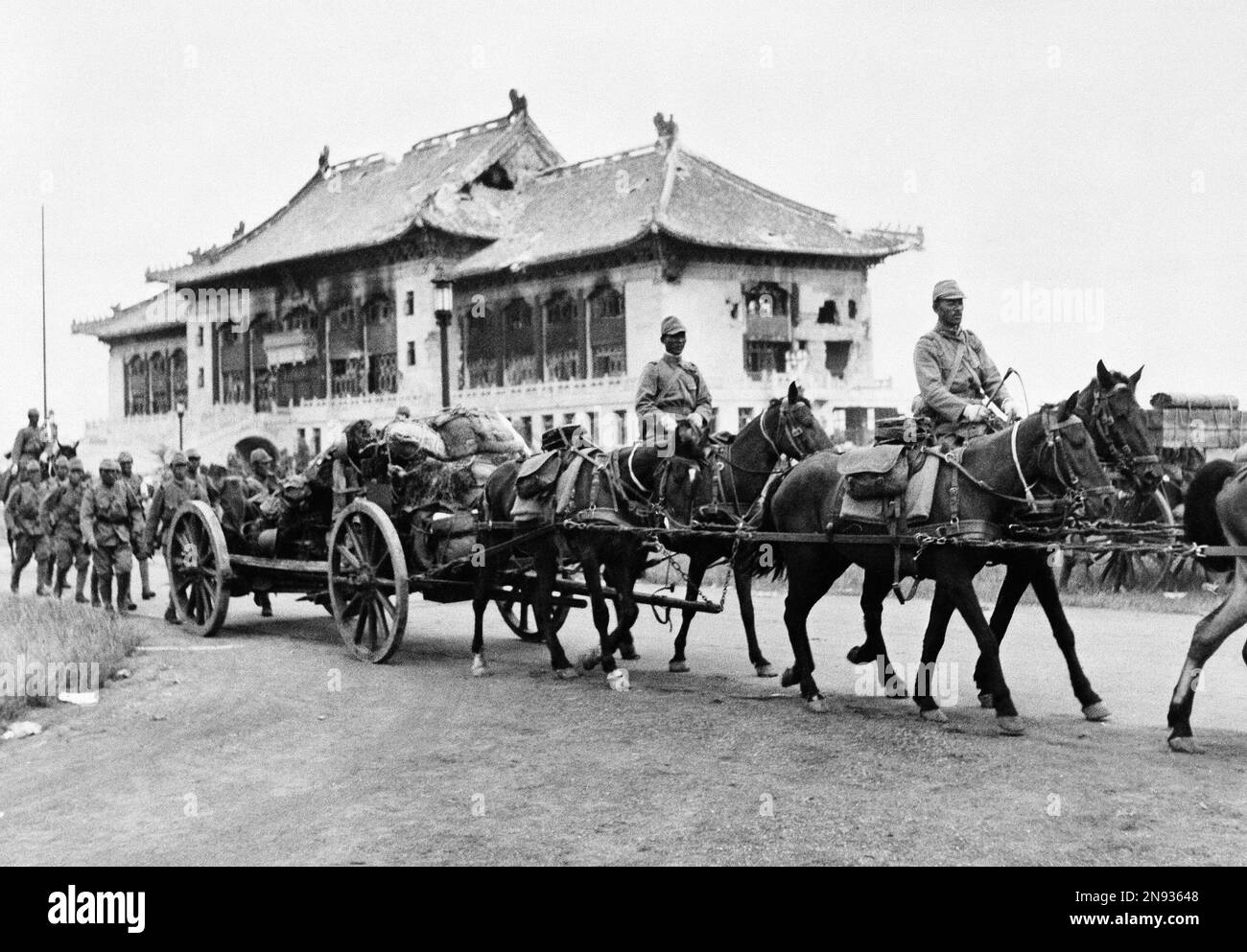 Past the shell-scarred municipal building in Kiangwan, symbolic of the destruction there of ...