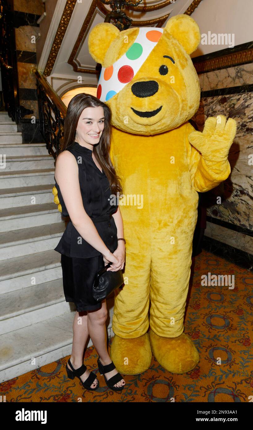 Lucille Sharp is seen posing with Pudsey the Bear on arriving for the ...