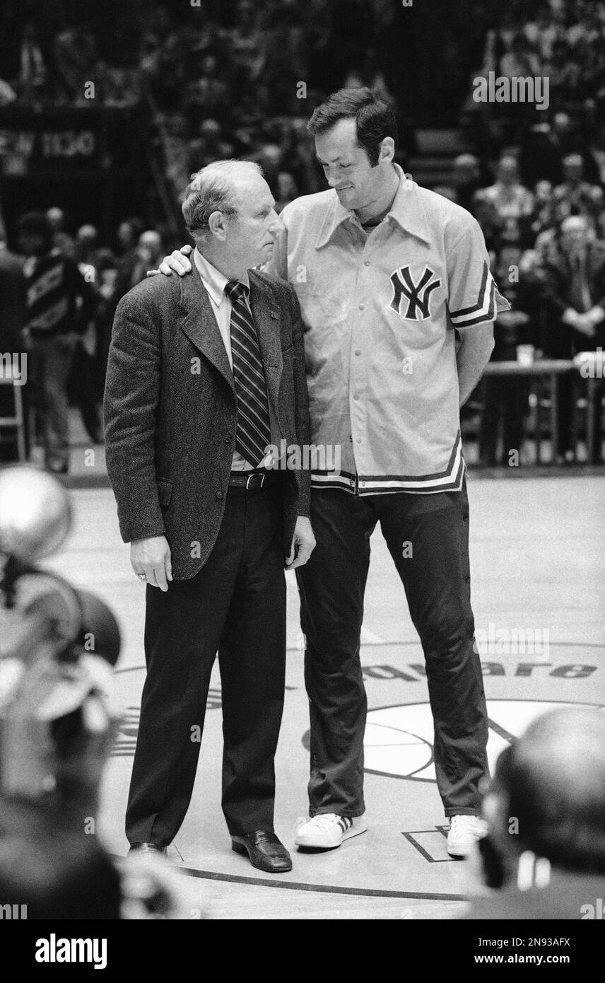 New York Knicks forward Bill Bradley, right, puts his arm around his ...