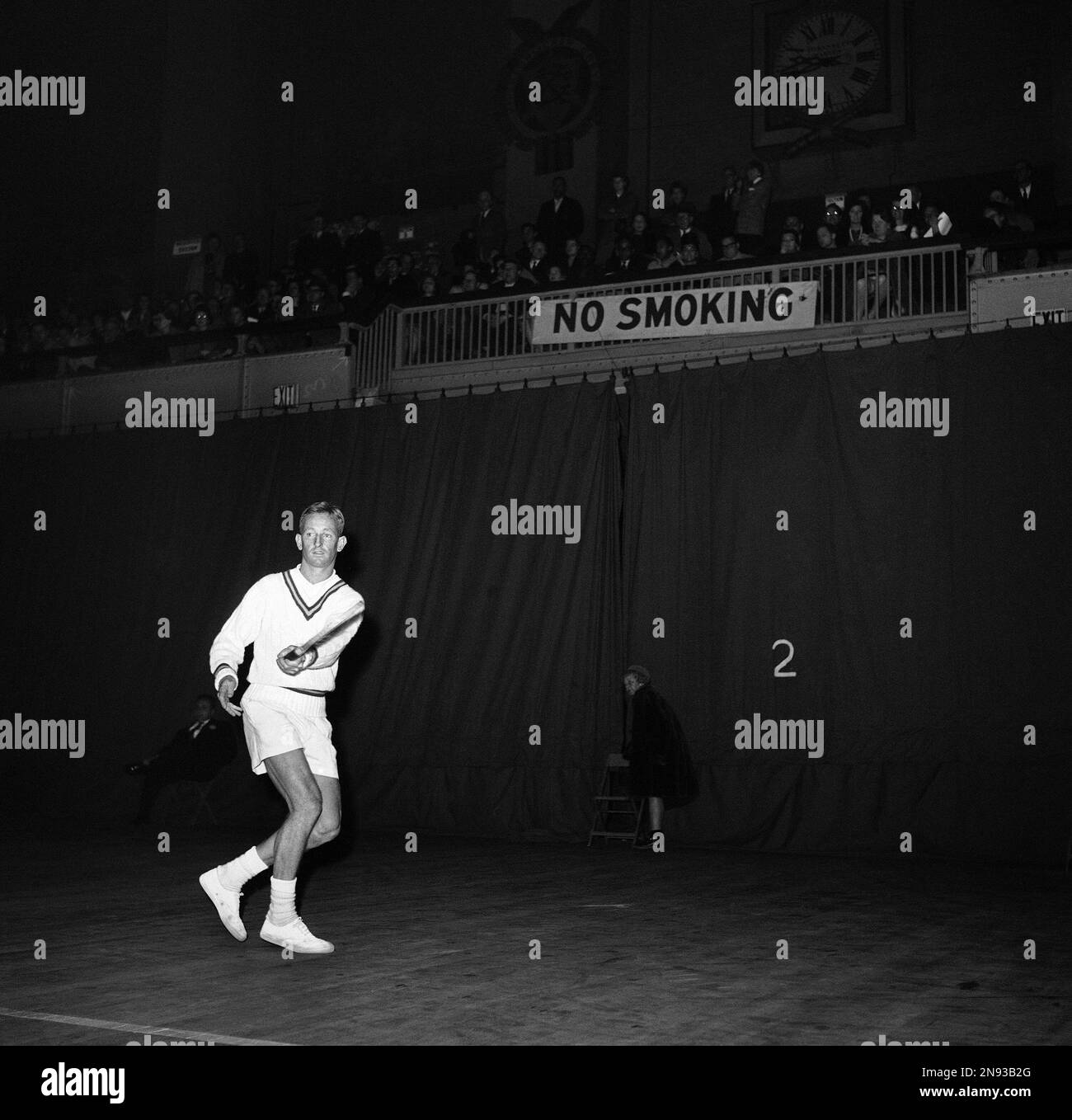 Rod Laver of Australia, warms up prior to his match in the National ...