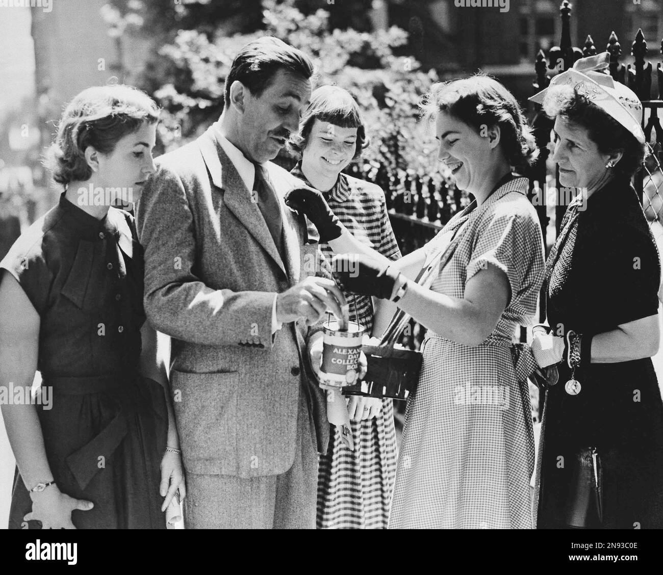 Walt Disney, famed American animator, and his family arrived in England ...