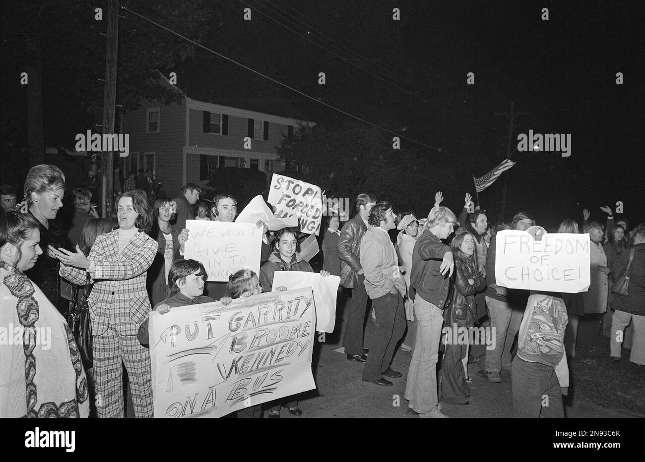 Demonstrators carrying signs gather the night of Oct. 5, 1974 outside ...