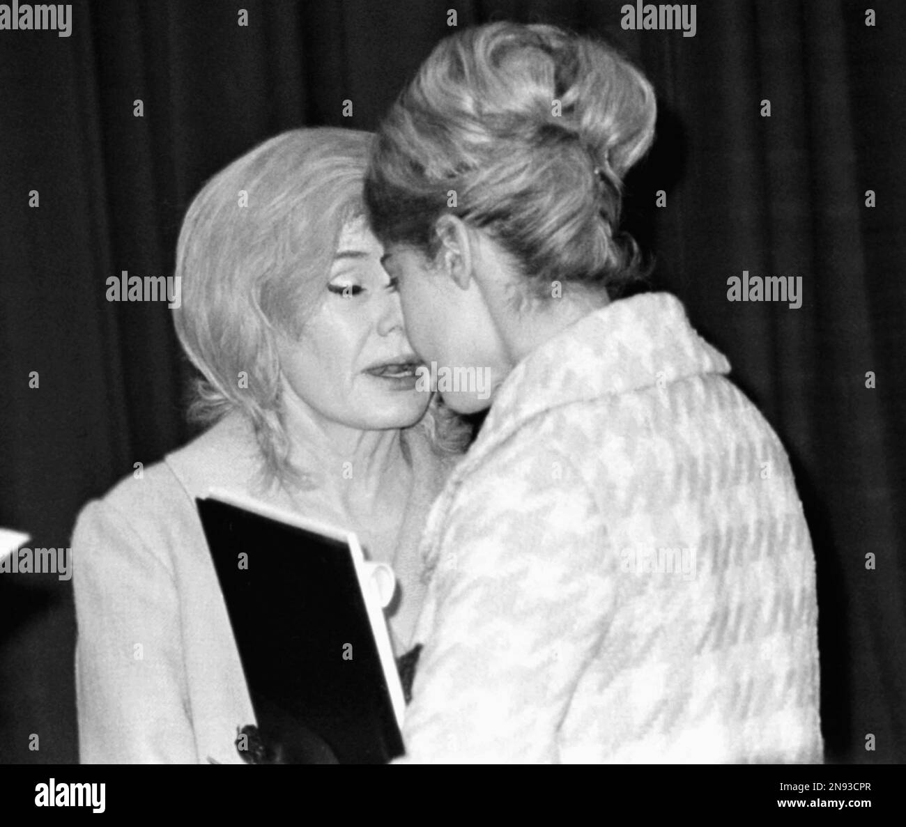 Candace Mossler, left, whispers to her attorney, Marian Rosen, during a ...