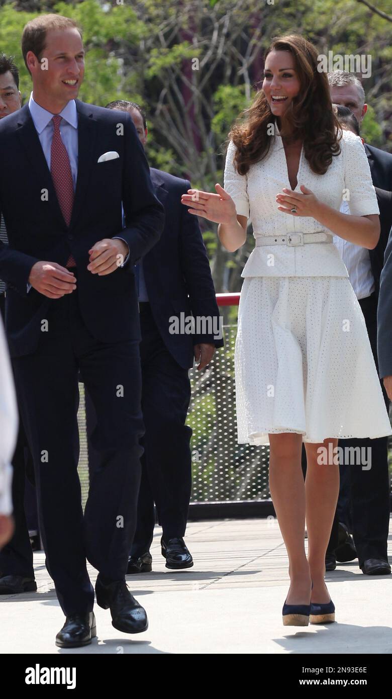 Britain's Prince William, left, and his wife Kate, the Duke of ...