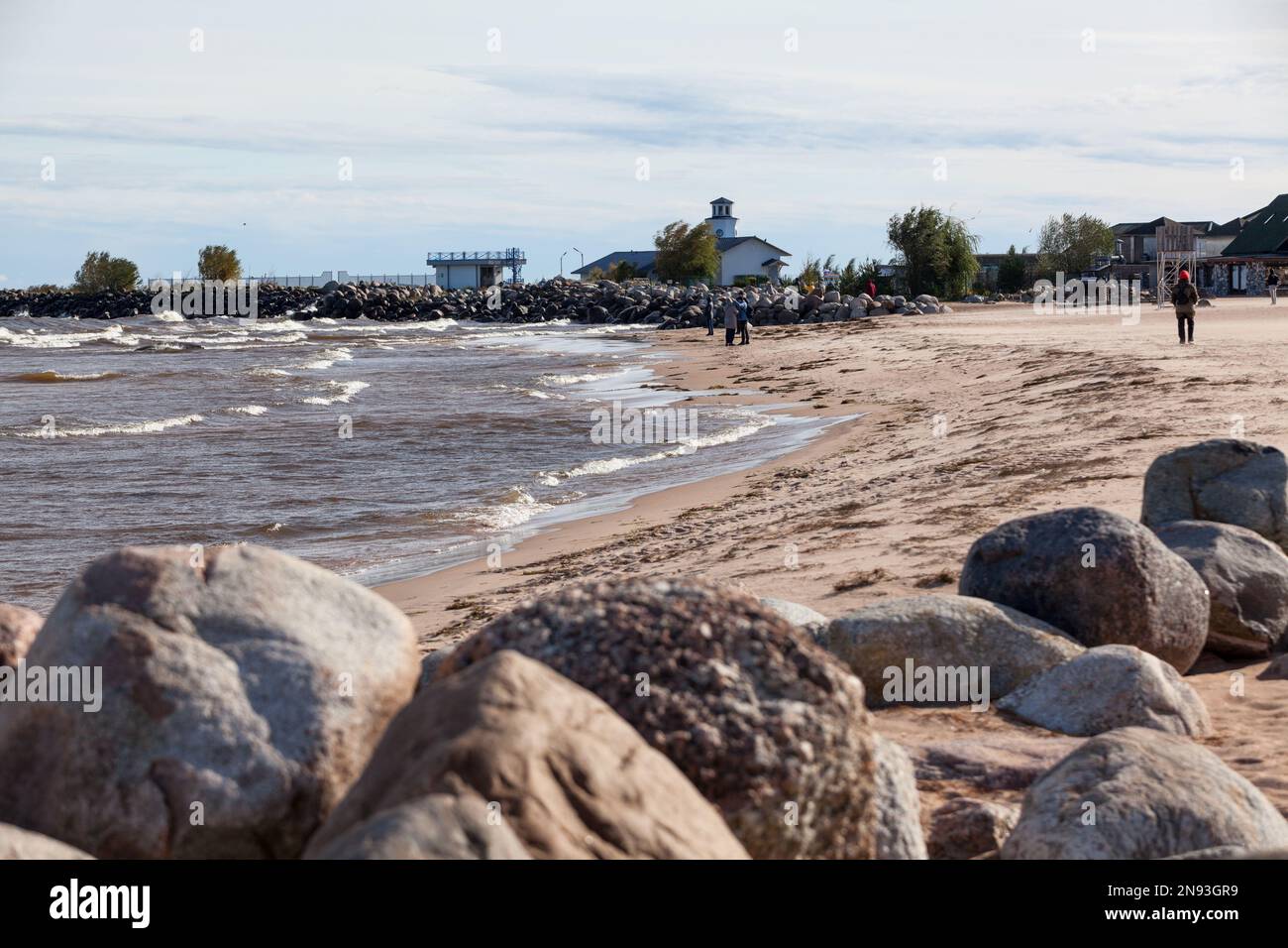 Sandy beach during strong wind. The territory of the recreation center ...