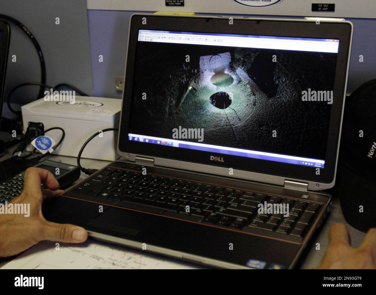 A sonar image of the wreckage of the USS Hatteras emerges on a computer ...
