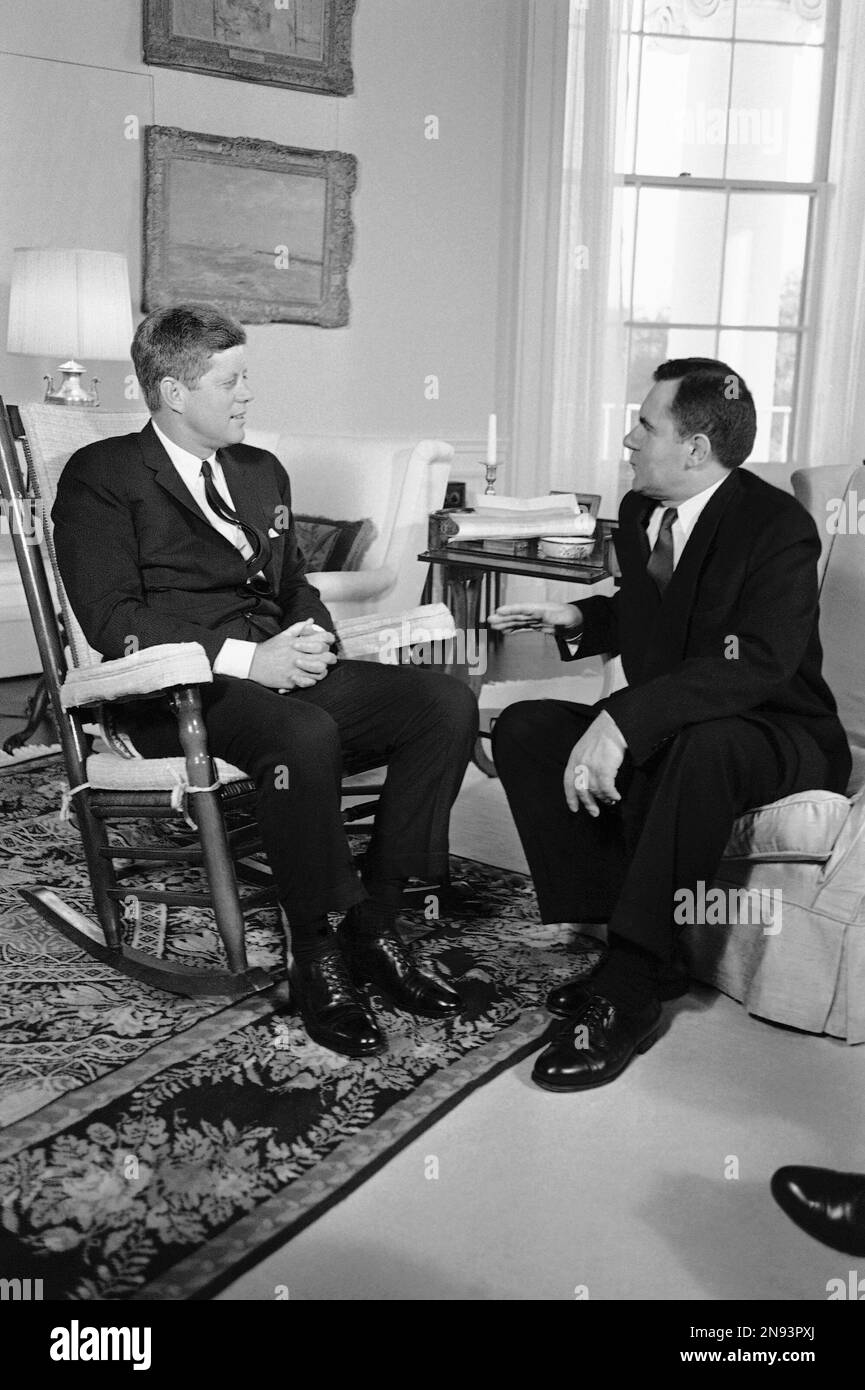 President John Kennedy sits in his favorite rocker as he talks with ...