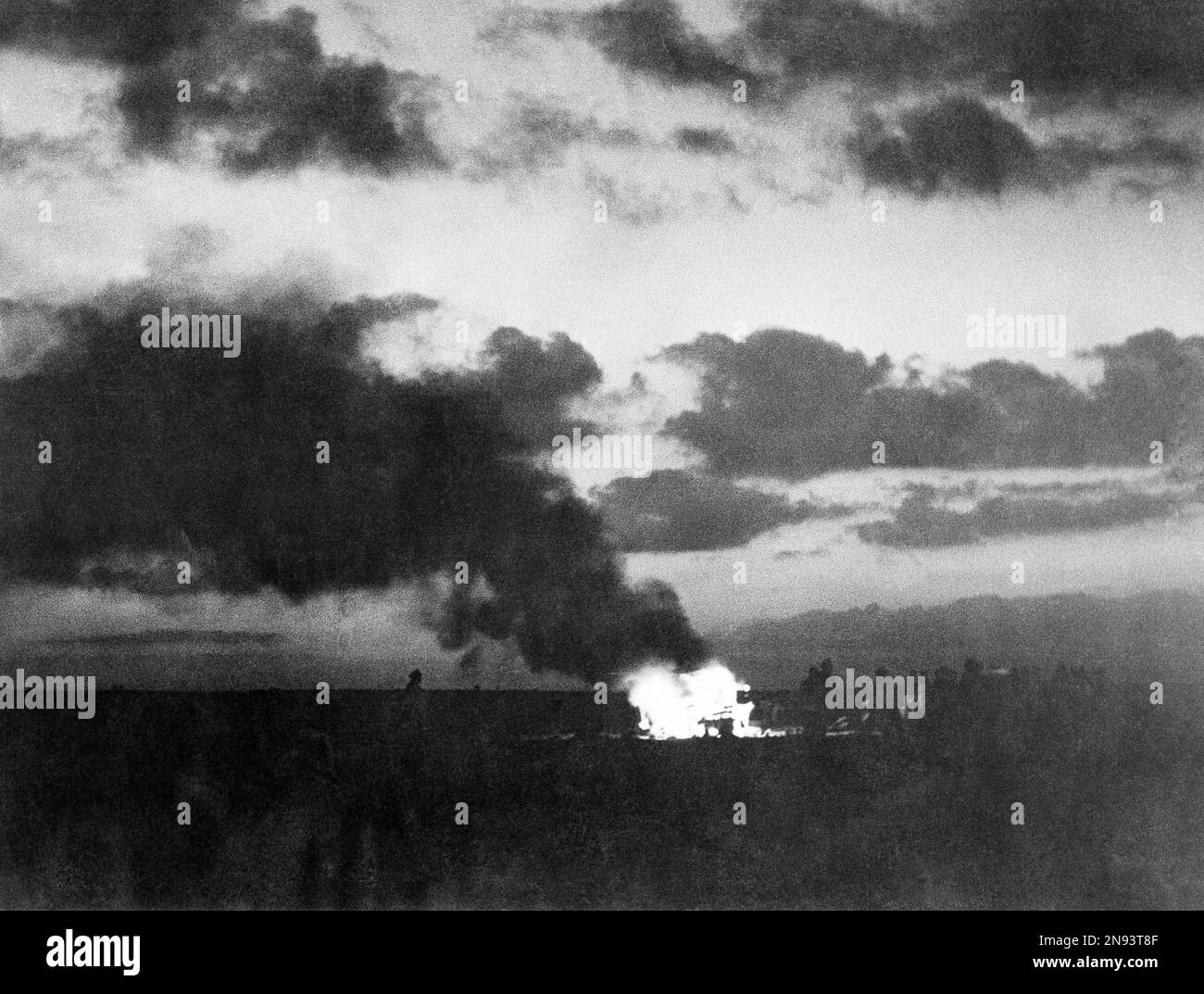 The wreckage of a German raider burns on the ground after it had been ...