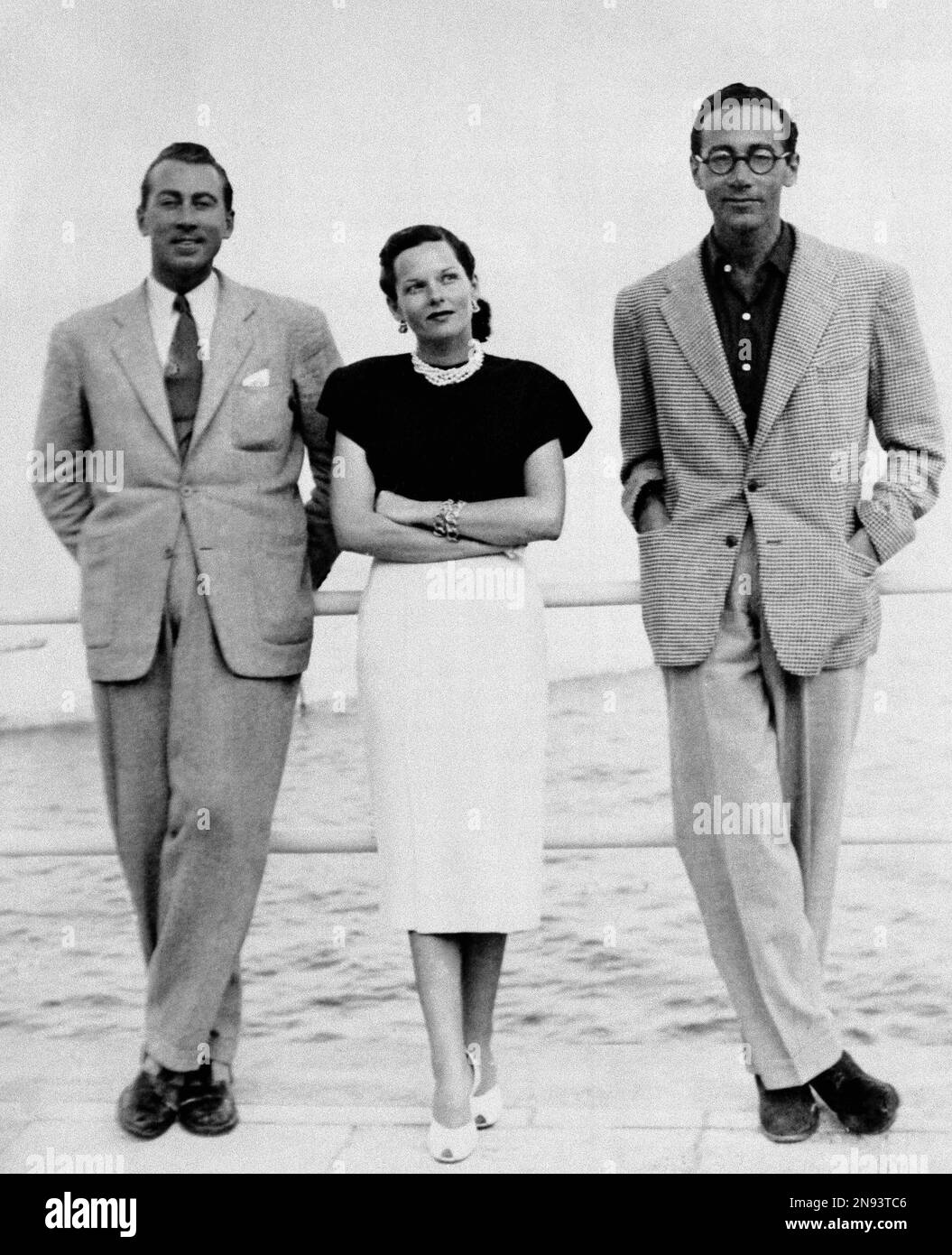 Virginia Hill Hauser stands with two acquaintances on the French ...