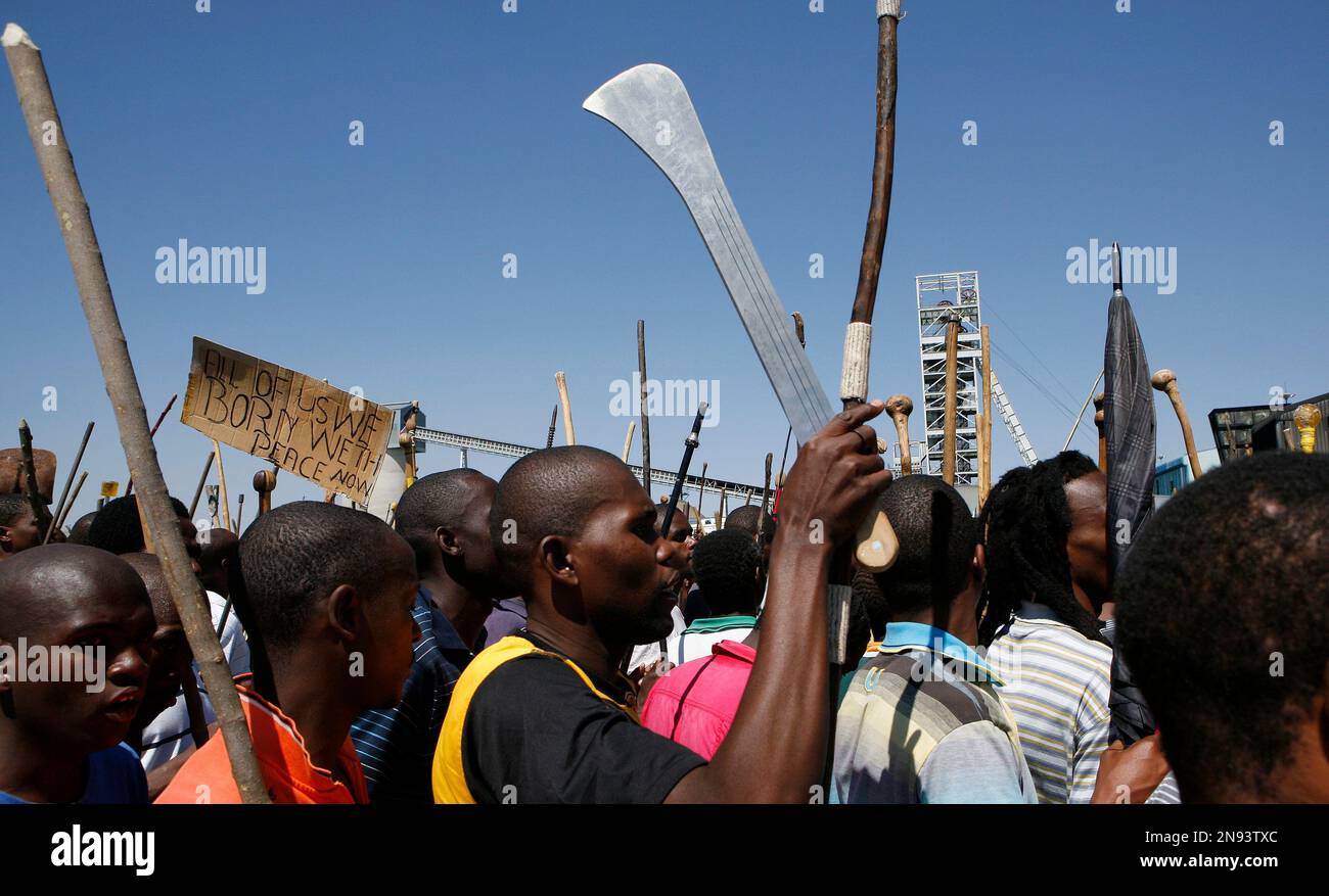 Miner mine workers sing and dance as they march to Lonmin Platinum Mine ...