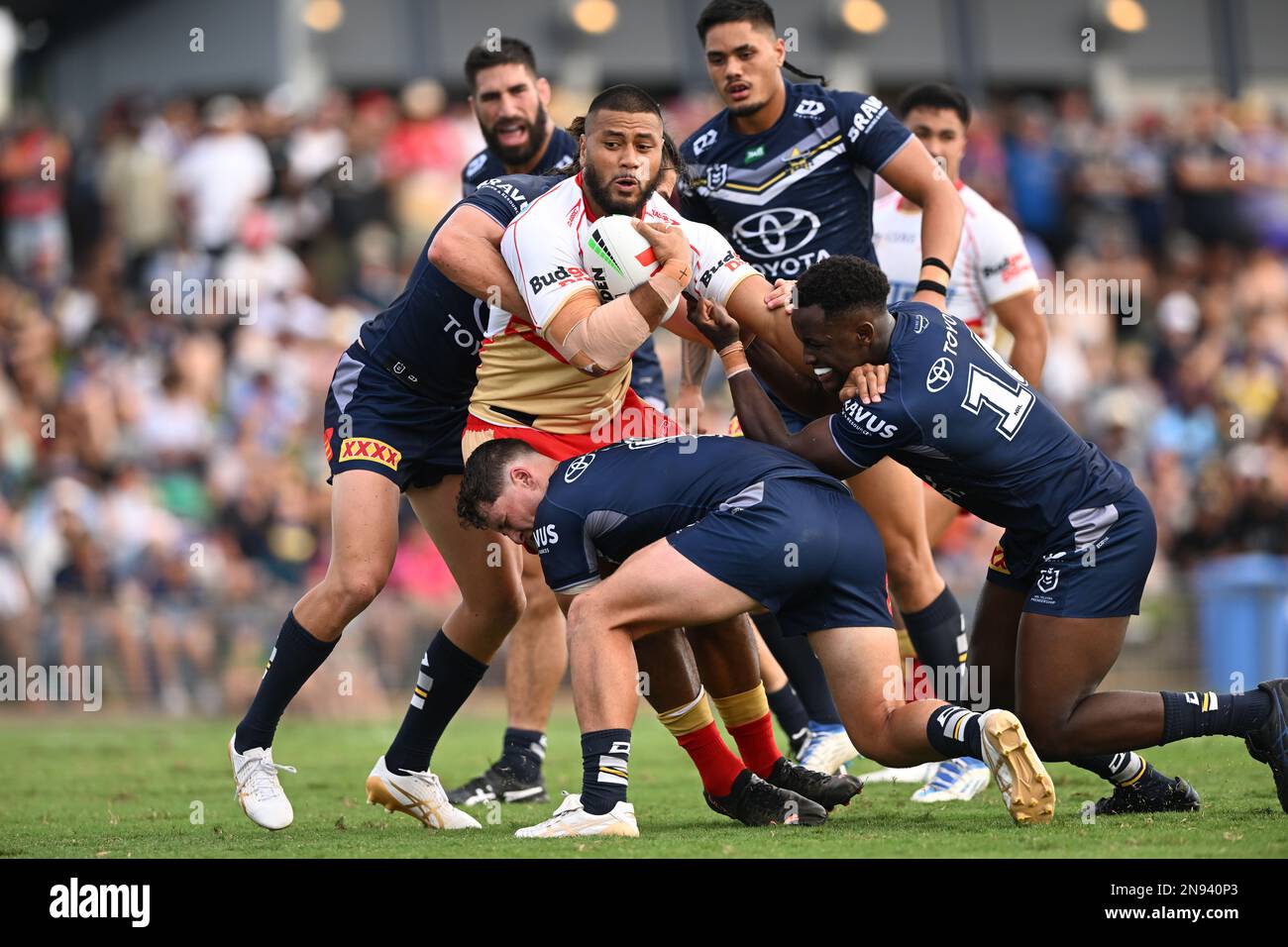 Poasa Faamausili of the Dolphins is tackled during the NRL Pre-Season ...