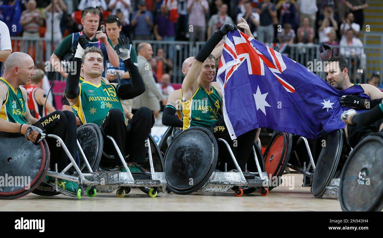 Members of the Australian wheelchair rugby team celebrate after they ...