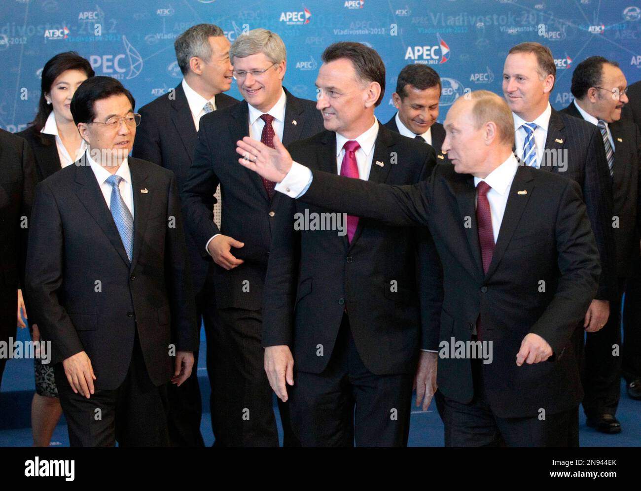 Russian President Vladimir Putin leads the way as leaders walk off ...