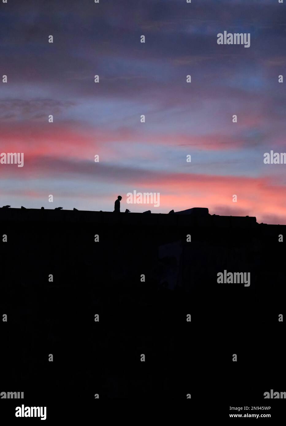 colourful sunset with minimal subject at rooftop of a building Stock ...
