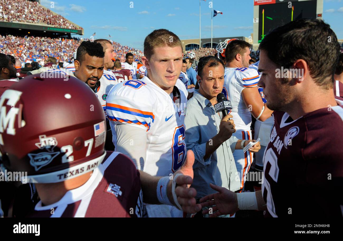 Florida quarterback Jeff Driskel, center, congratulates Texas A&M ...