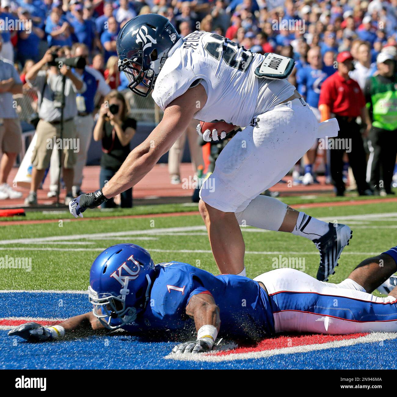 Rice running back Turner Petersen (26) gets past Kansas safety Lubbock ...