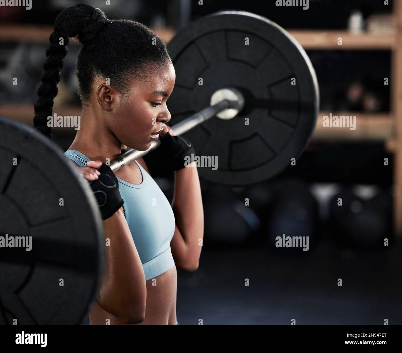 And she lifted happily ever after. a fit young woman working out with a ...