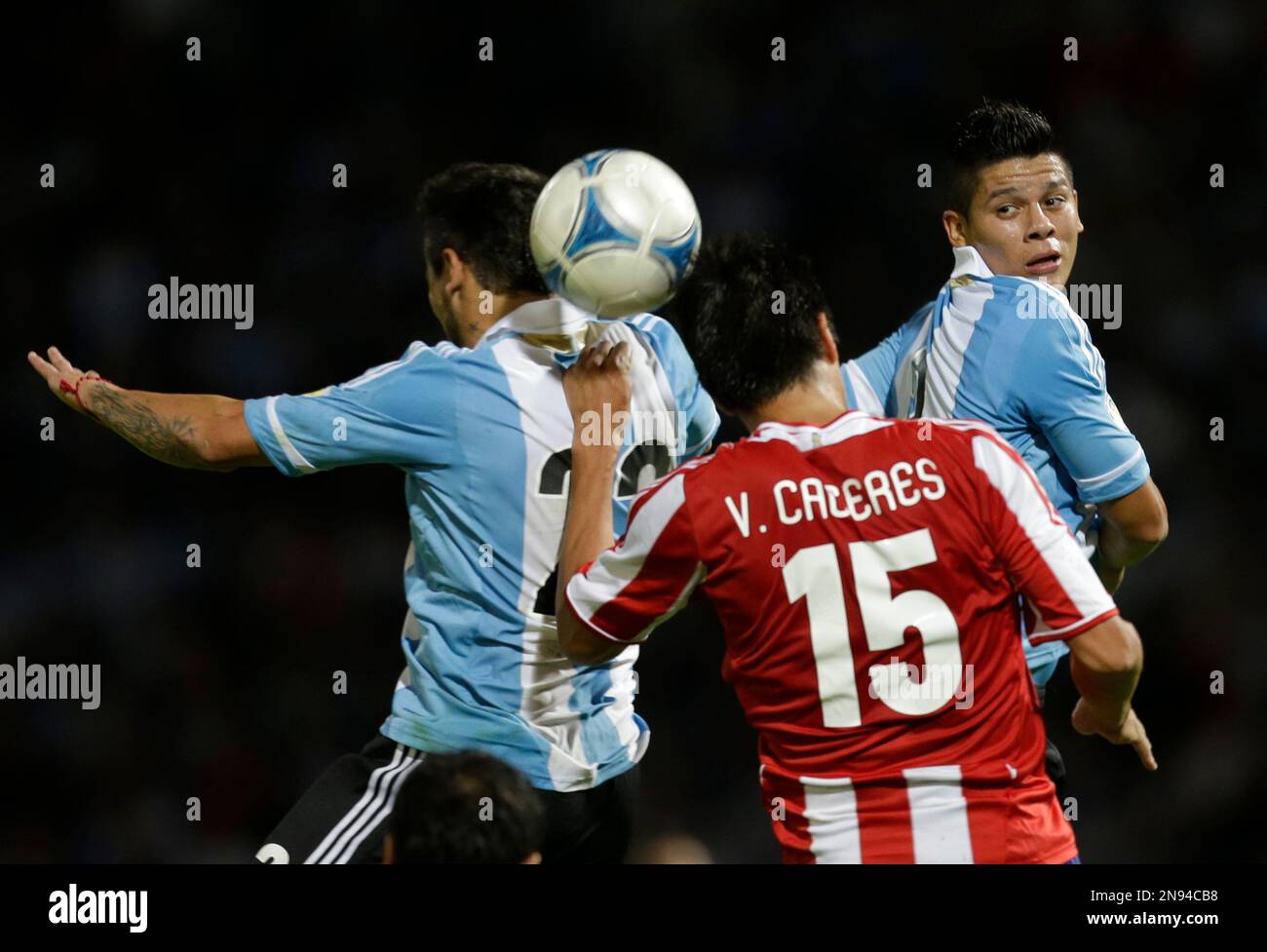 Argentina's Marcos Rojo, top right, heads the ball during a World Cup ...
