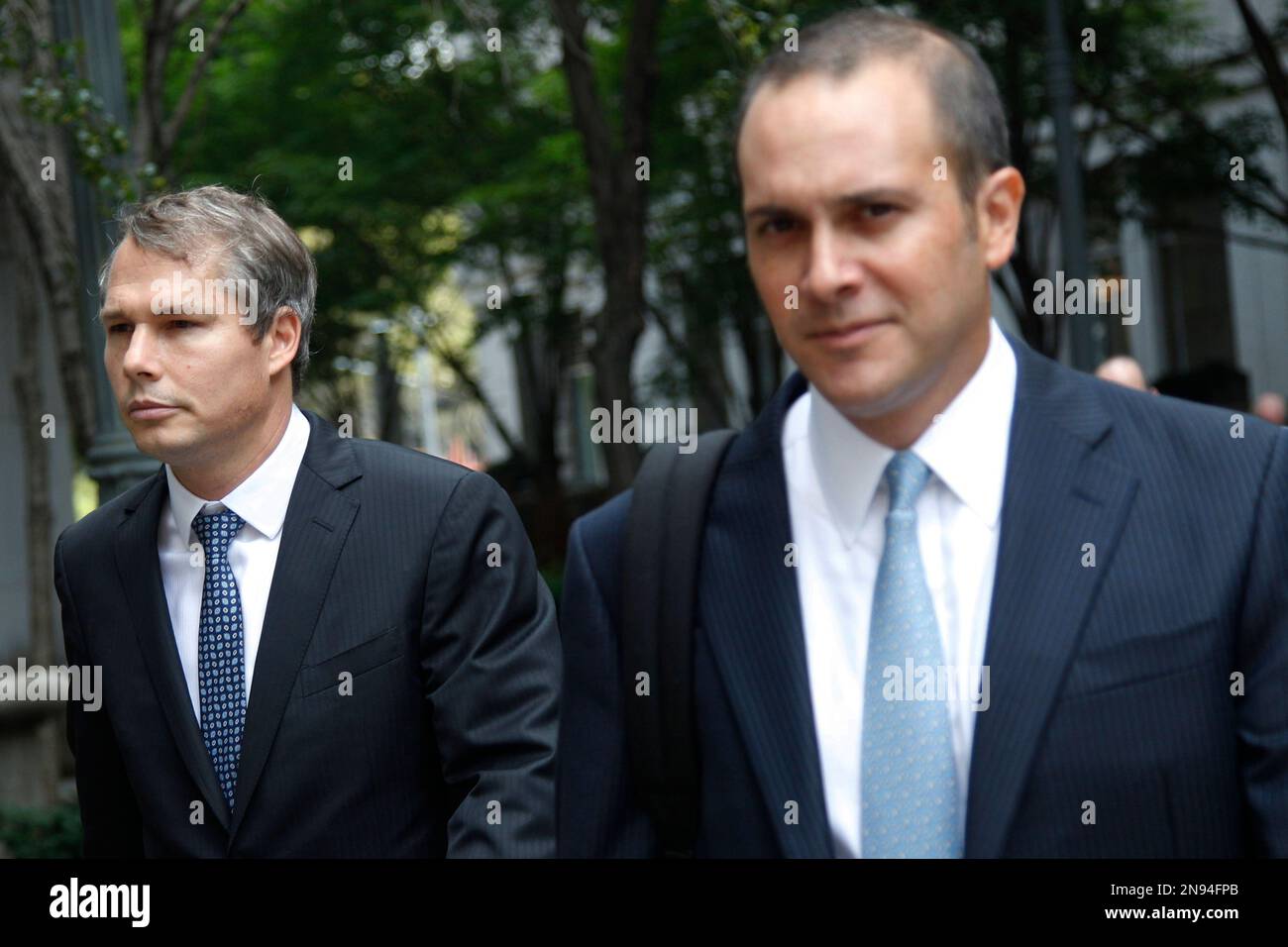 Shepard Fairey, left, leaves Manhattan Federal court in New York with ...